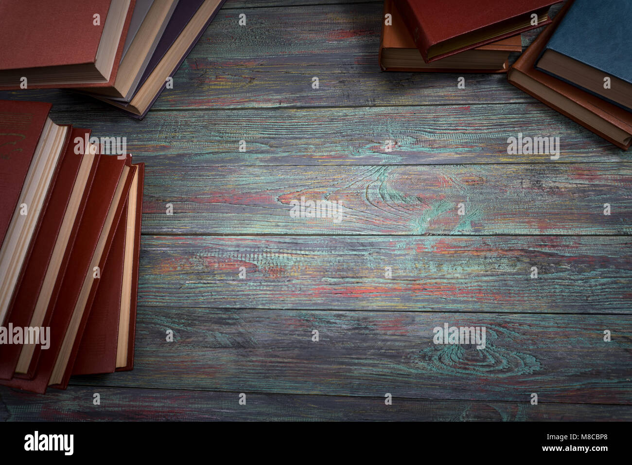 A lot of books on a colored wooden background with copy space Stock ...