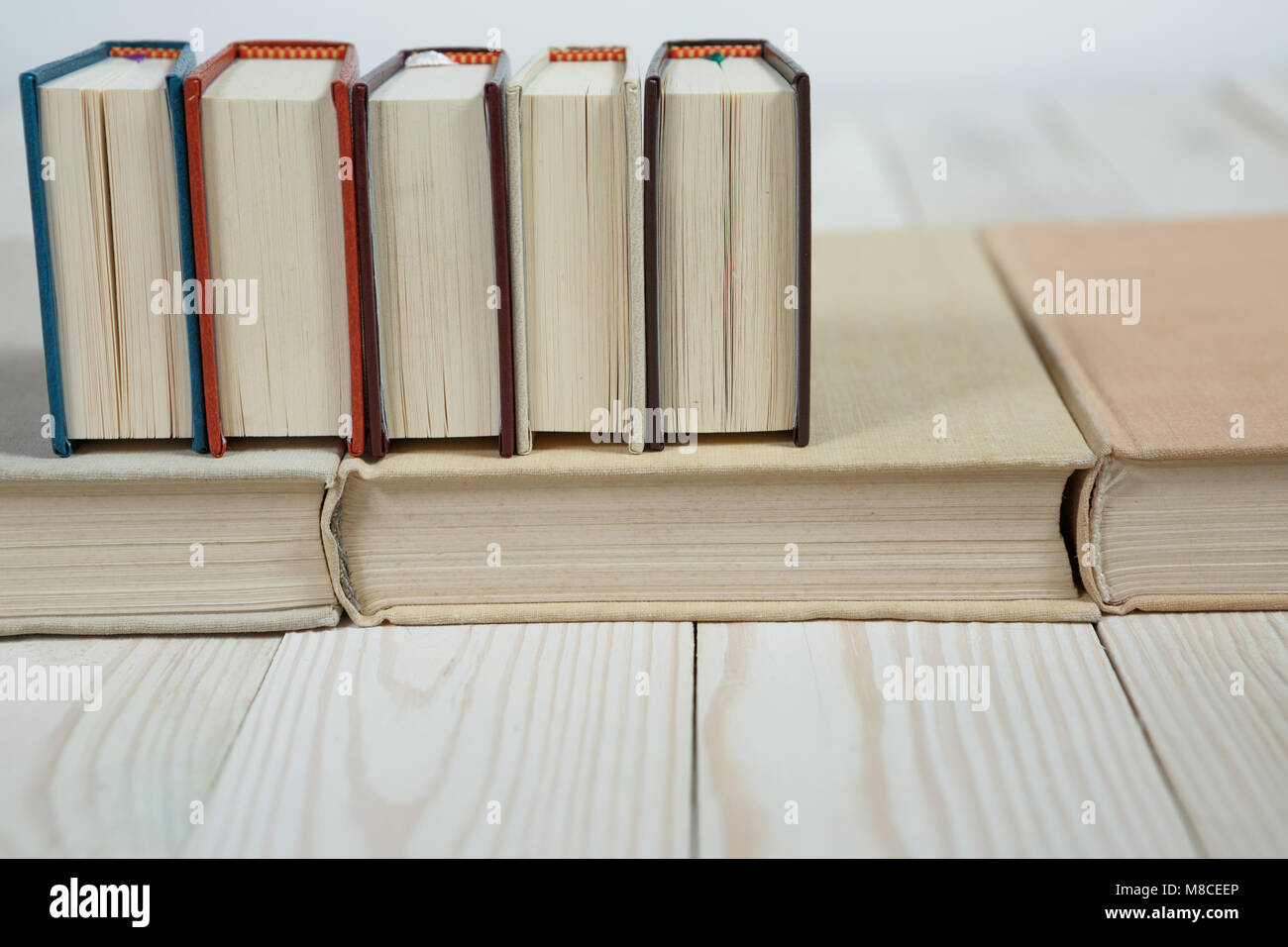 Pile of old books stacked on top of each other Stock Photo - Alamy