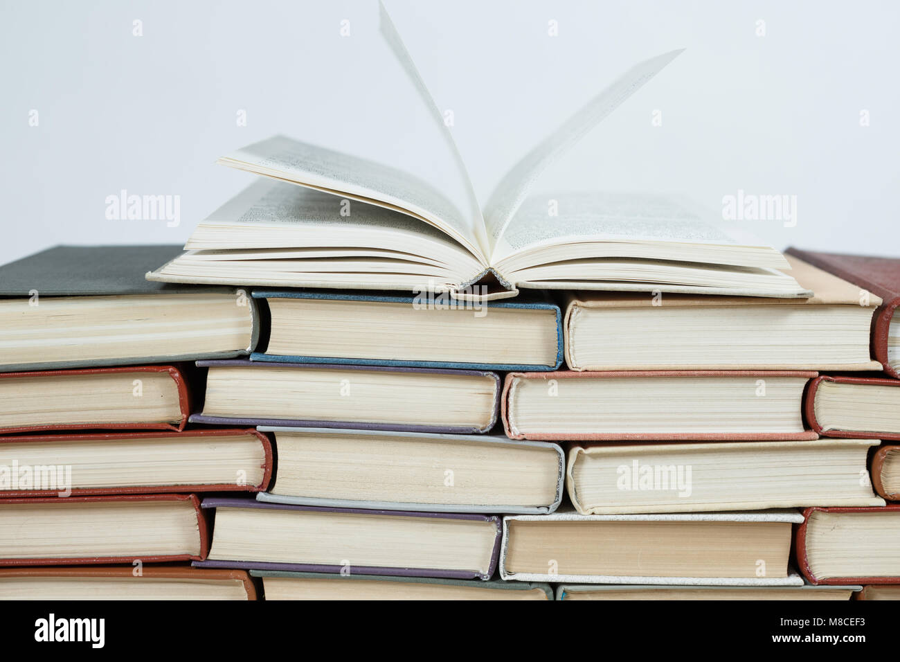 stack of old books pastel colors Stock Photo - Alamy