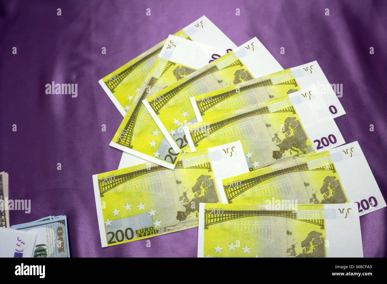 200 Euro banknotes on a purple background Stock Photo - Alamy