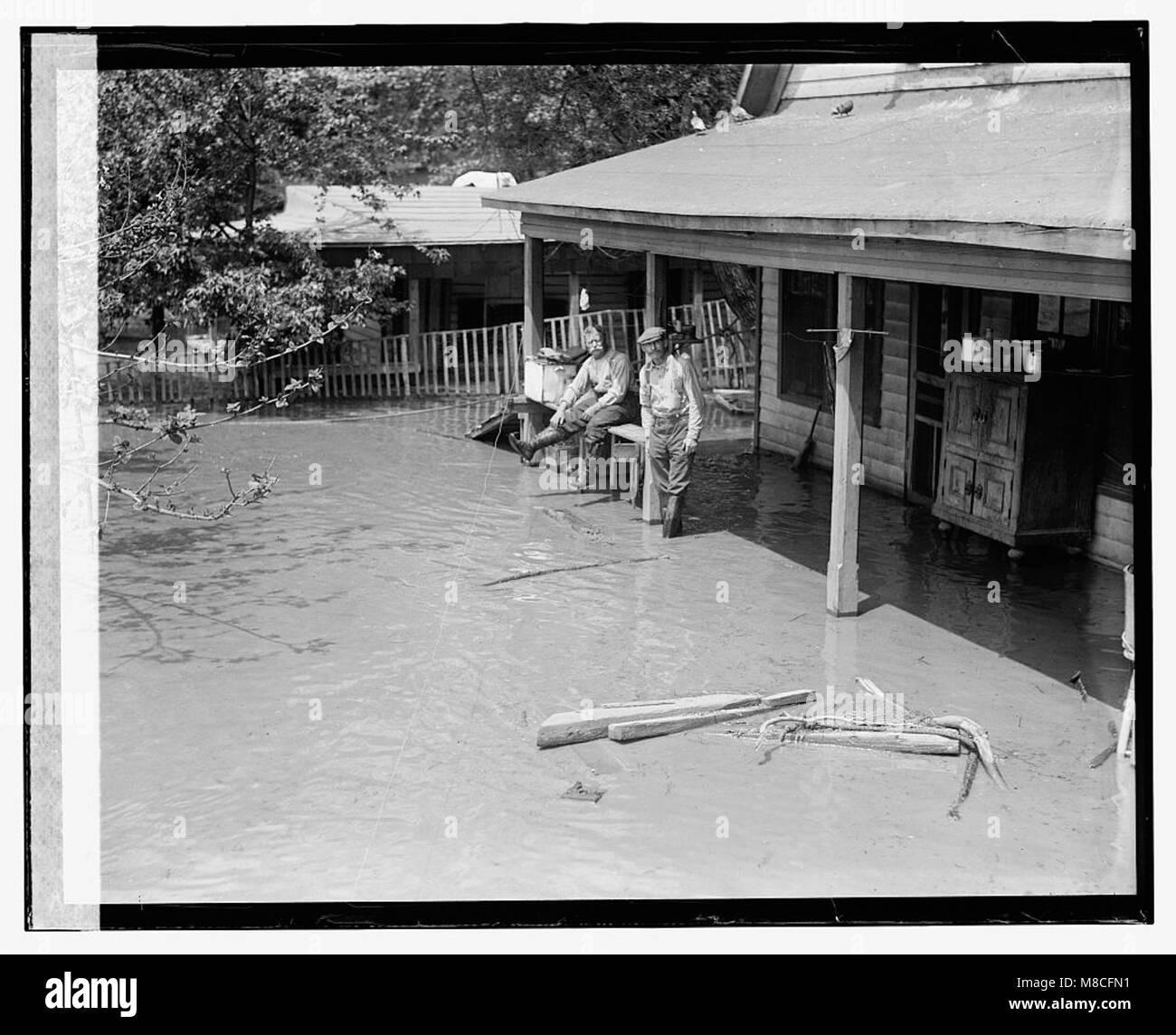 A photograph documenting a flood event. The image captures the extent ...