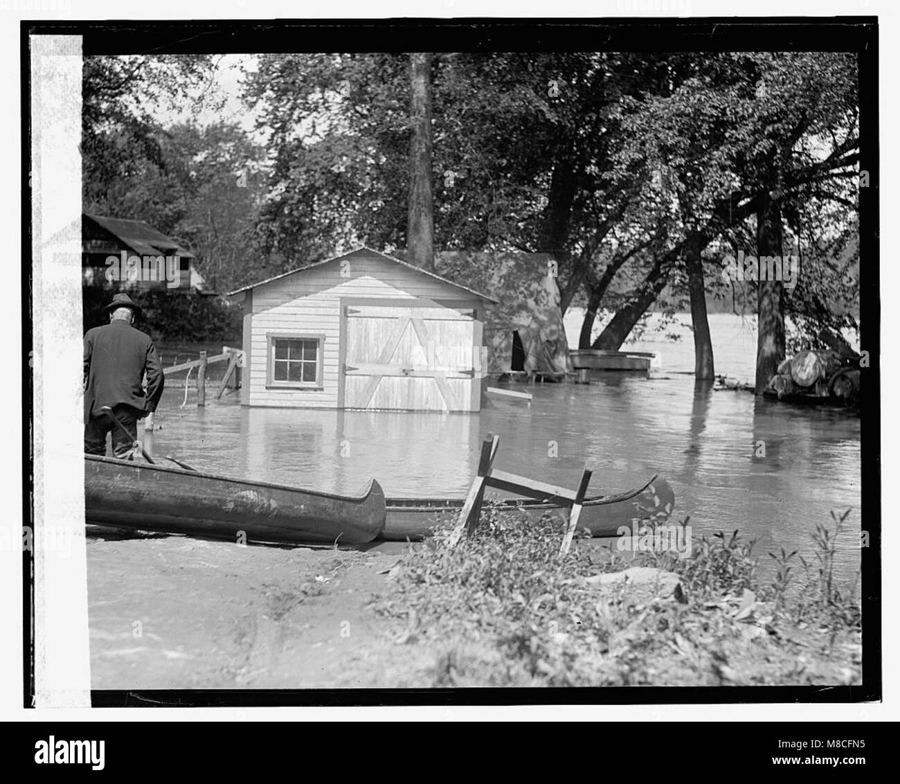 This photograph captures a scene of flooding, illustrating the ...