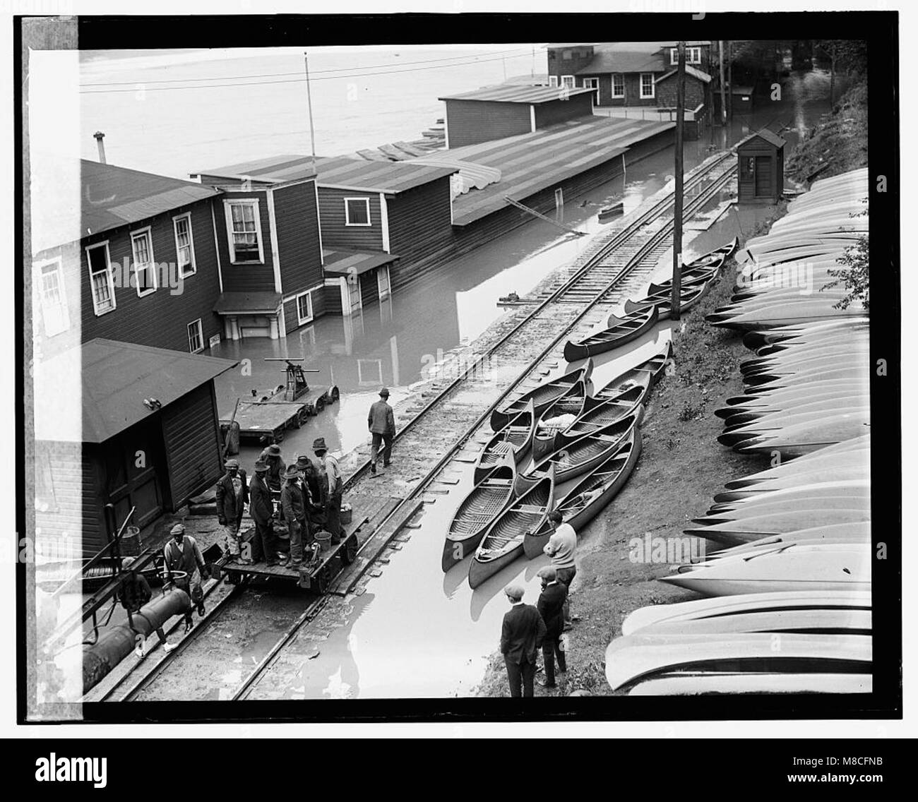 A photograph depicting the aftermath of a flood, showing the extent of ...