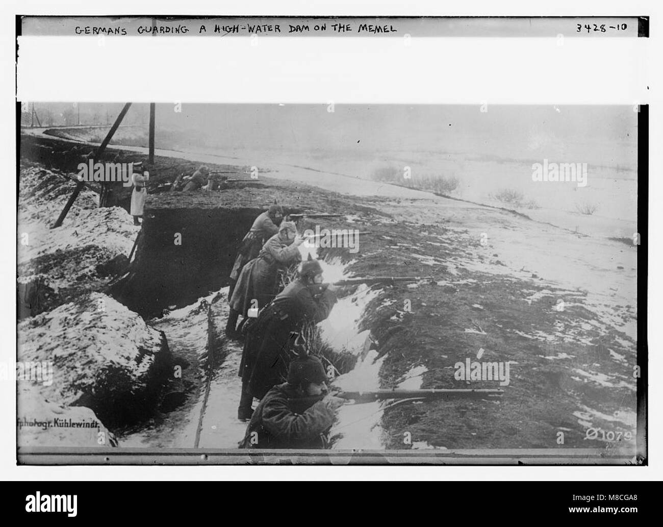 German soldiers are seen guarding a high-water dam on the Memel River ...