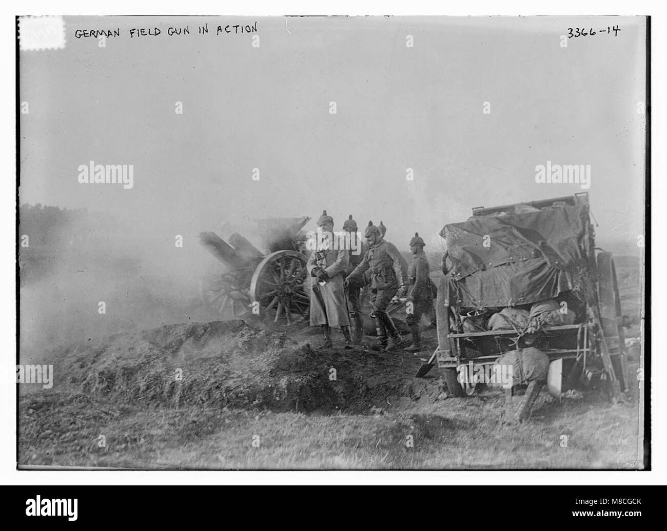 A photograph showing a German field gun in action during World War I ...
