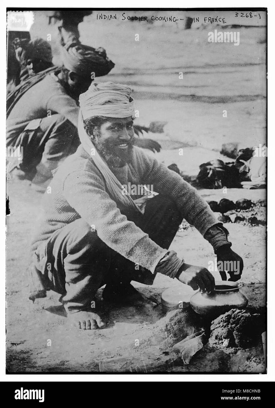 An Indian soldier cooking in France during World War I, showing a ...