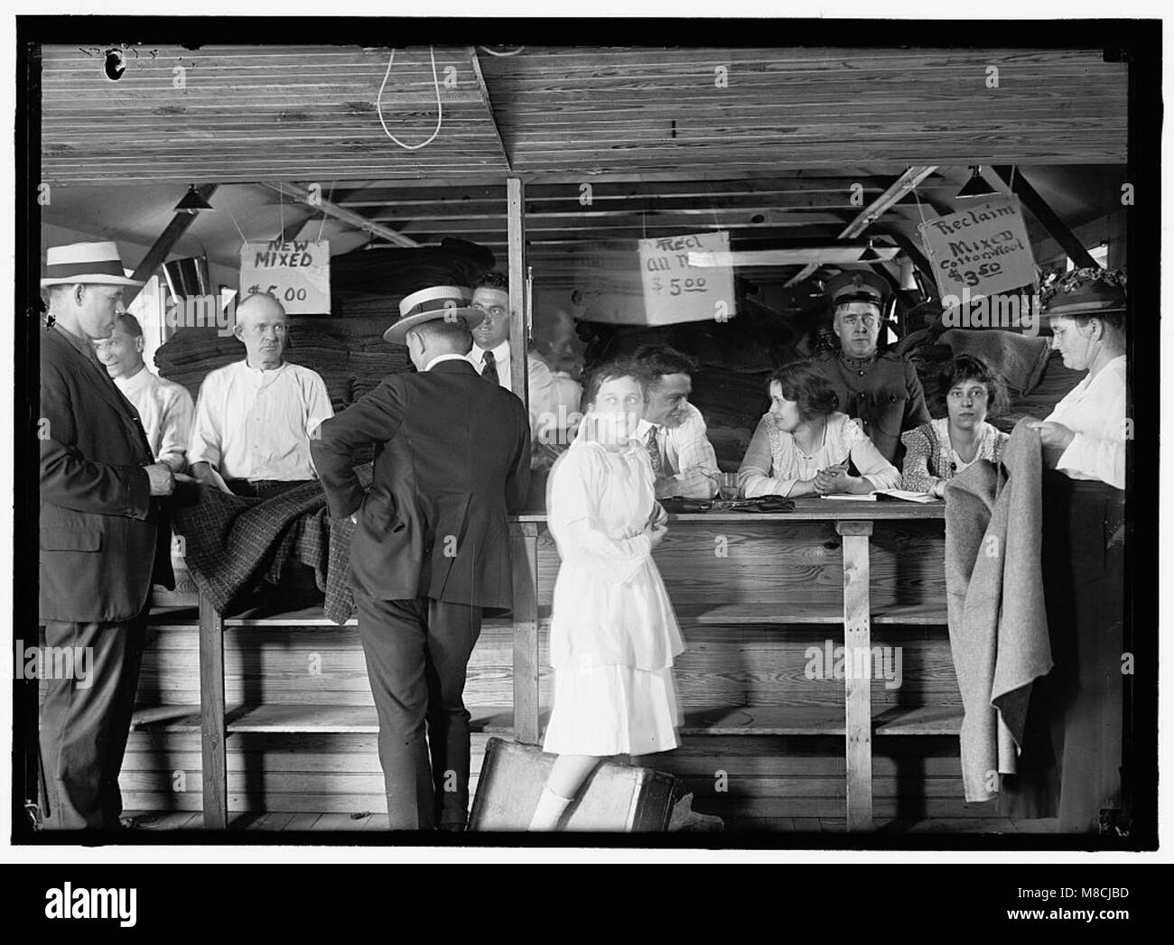 A historic photograph showing the U.S. Army purchasing food at a fish ...