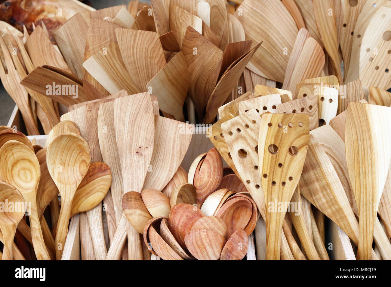 Wooden traditional kitchen spoons, forks and spatulas are sold at the ...