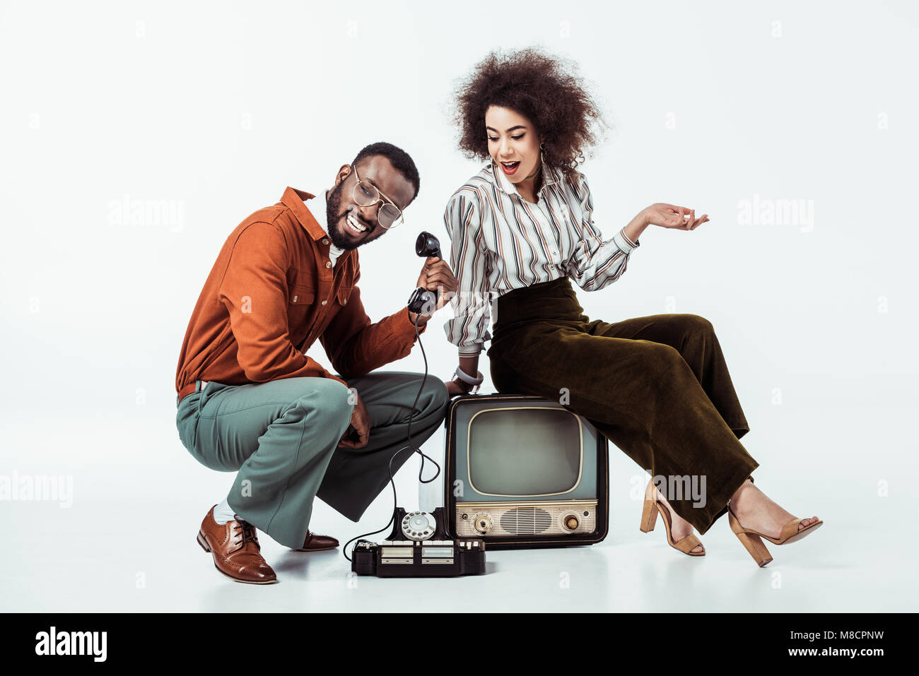 happy african american retro styled couple with vintage television and ...