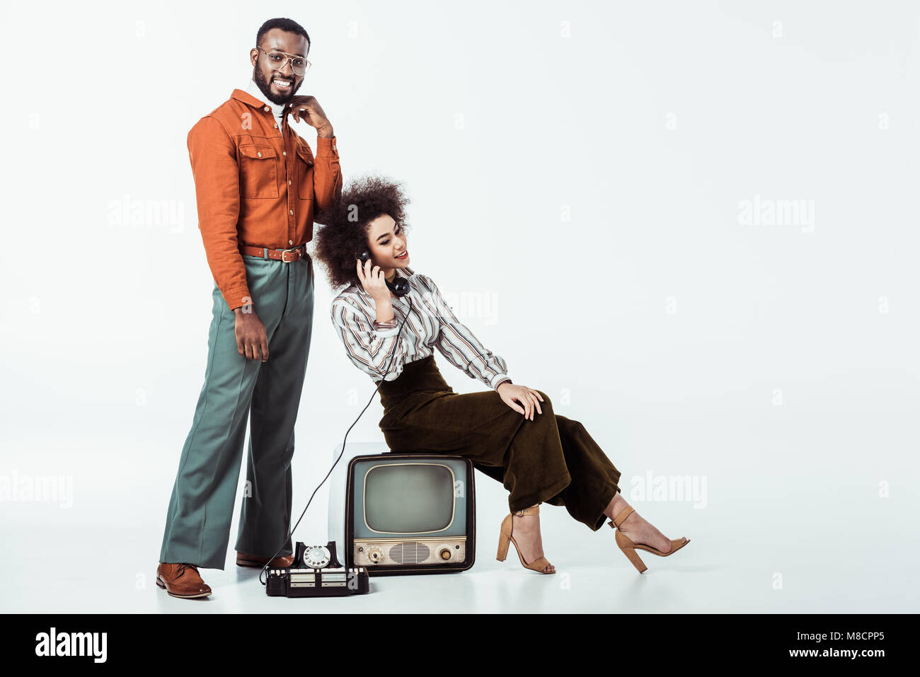 happy african american retro styled girlfriend sitting on vintage ...