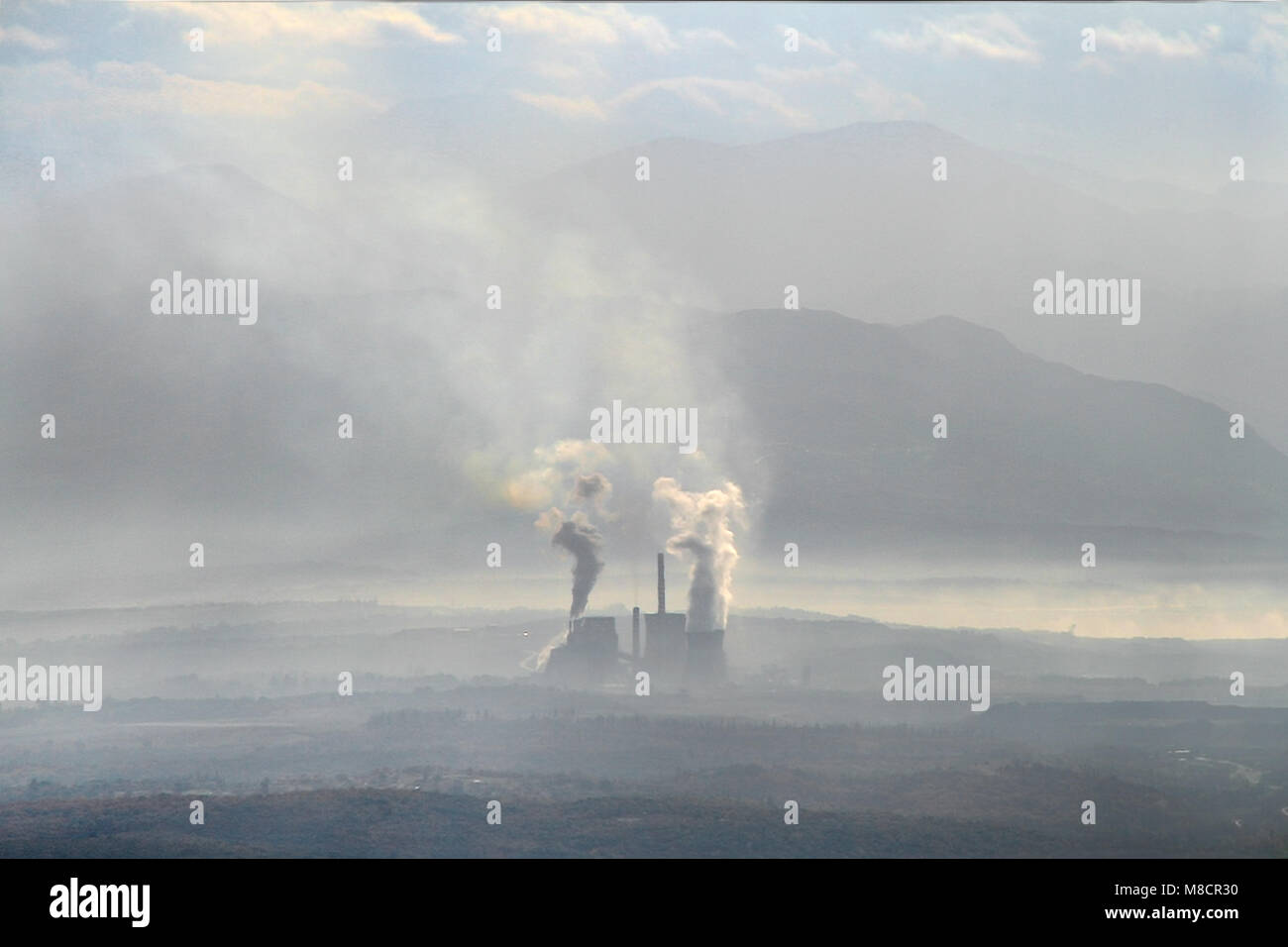 Landscape in mist and pollution. Factory pollutes the atmosphere ...