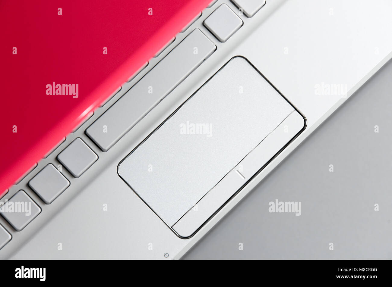 The keyboard and touchpad of small white laptop Stock Photo - Alamy