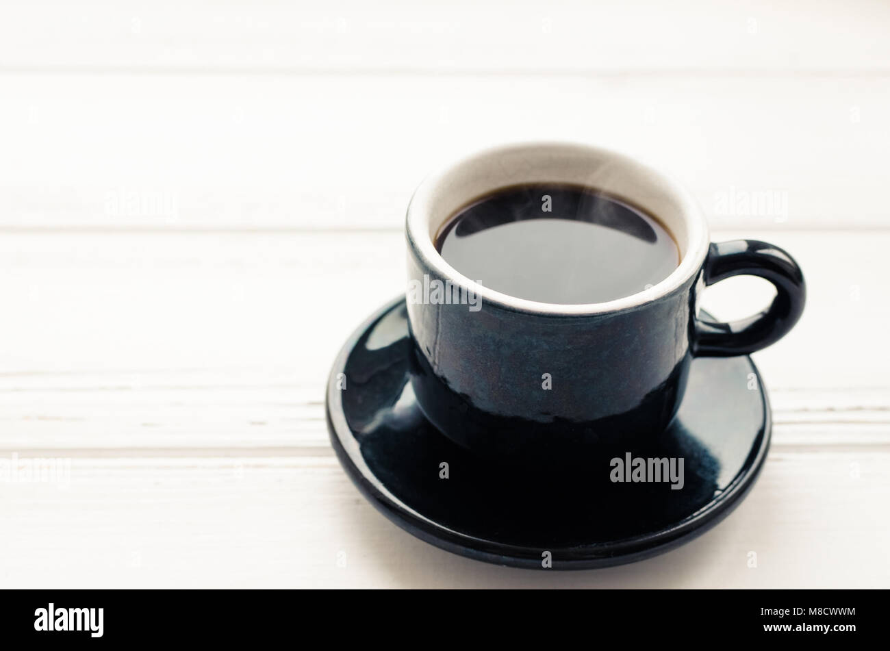 Cup of hot turkish coffee on white wooden table. Coffee break concept ...