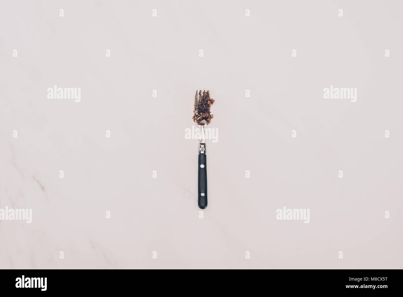 top view of fork with cake pieces isolated on grey Stock Photo - Alamy