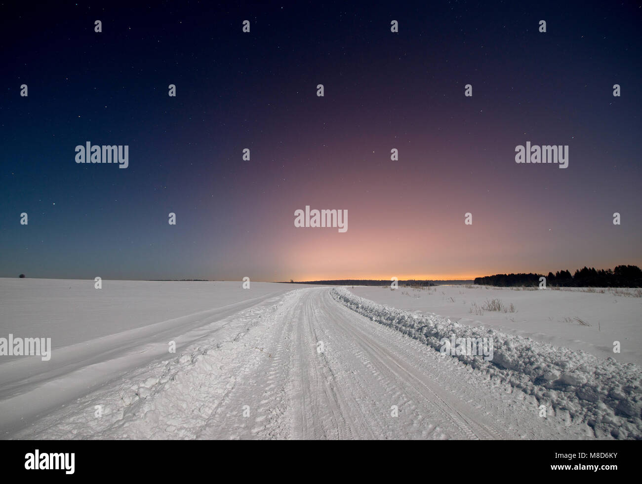 road in winter snowy night Stock Photo - Alamy