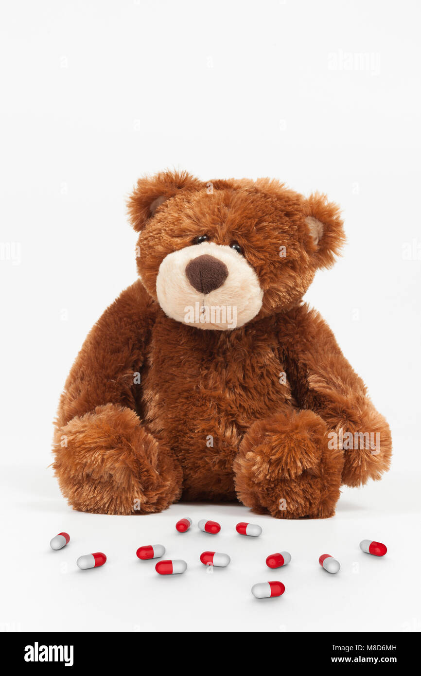 Sad stuffed animal with pills Stock Photo - Alamy