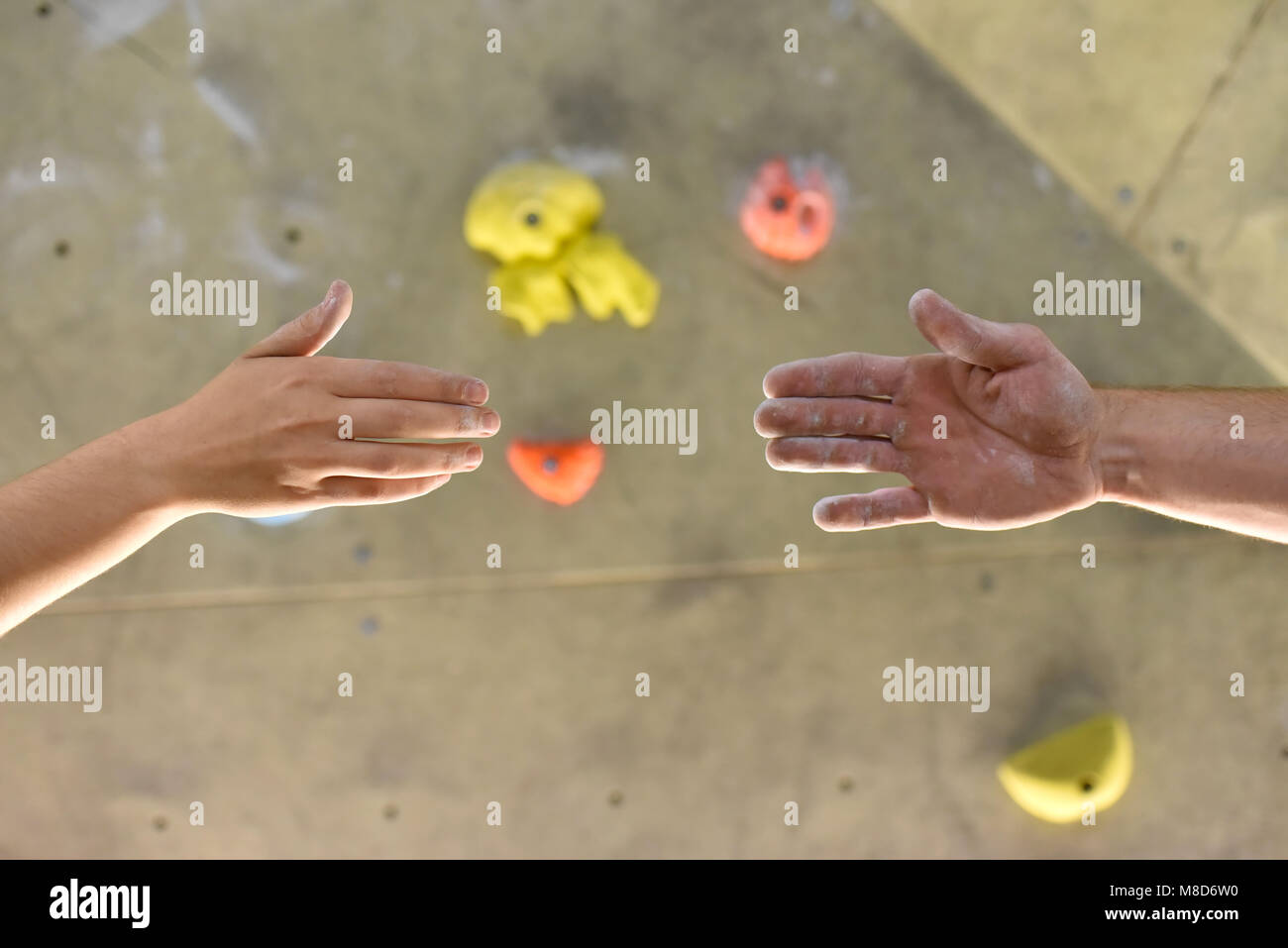 people bouldering in a climbing hall - indoor sports Stock Photo - Alamy