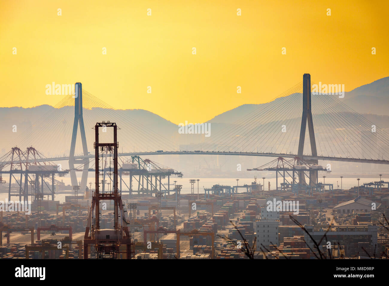 Busan Harbor Bay Bridge at sunset Stock Photo - Alamy