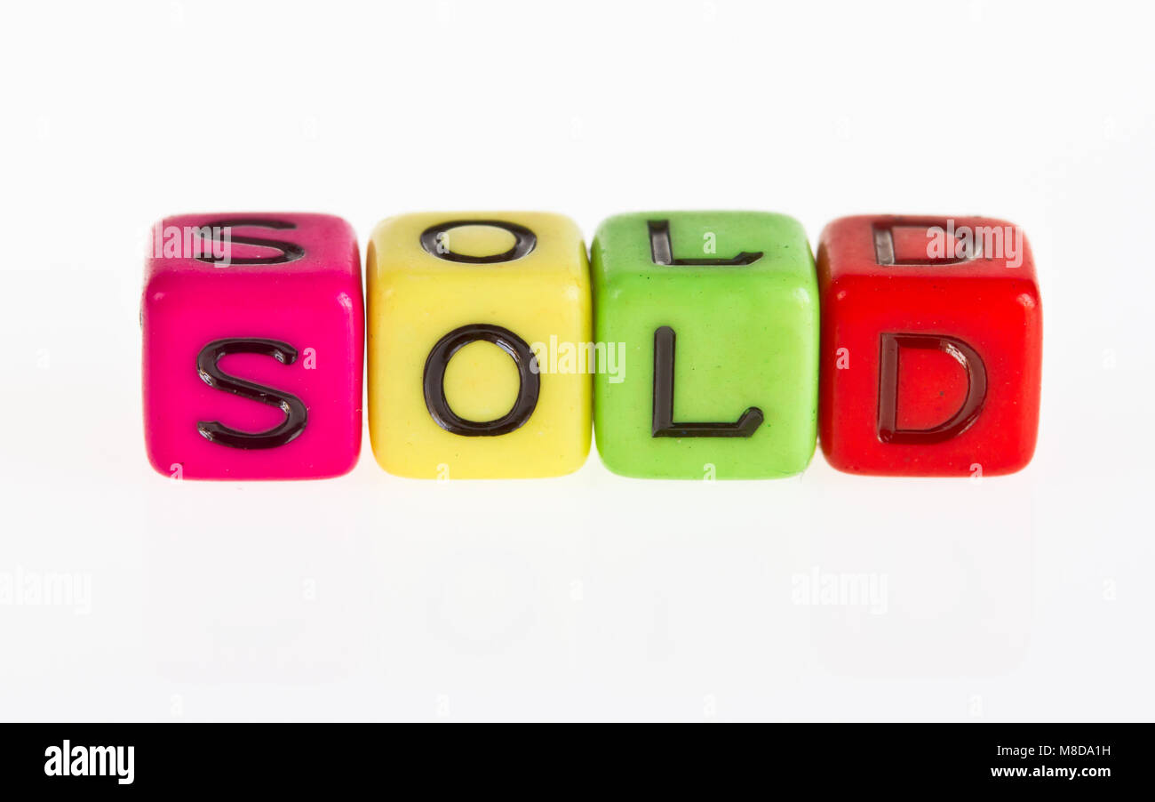 plastic blocks spelling out the word sold on white background Stock ...