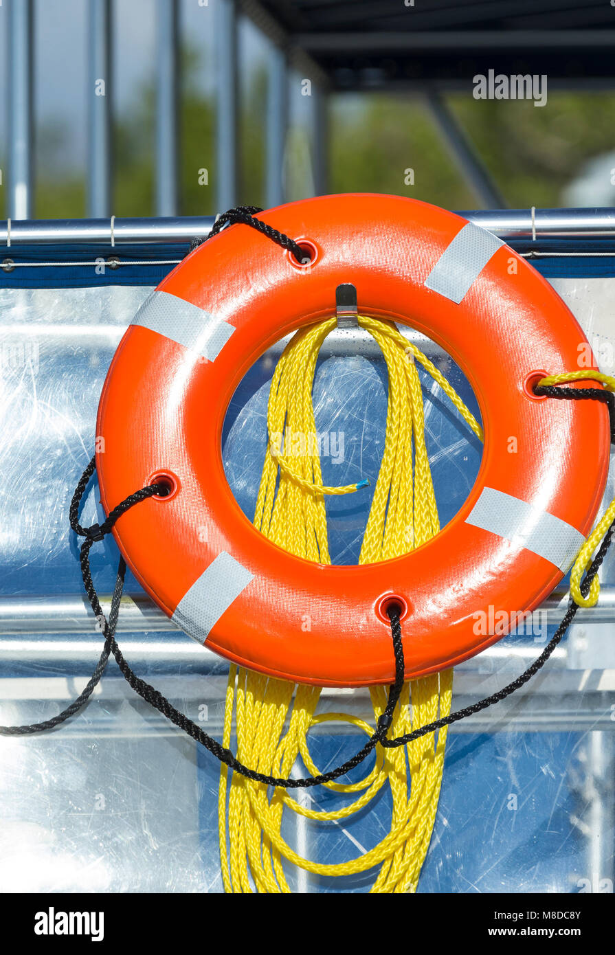 An orange life buoy for safety at sea Stock Photo - Alamy