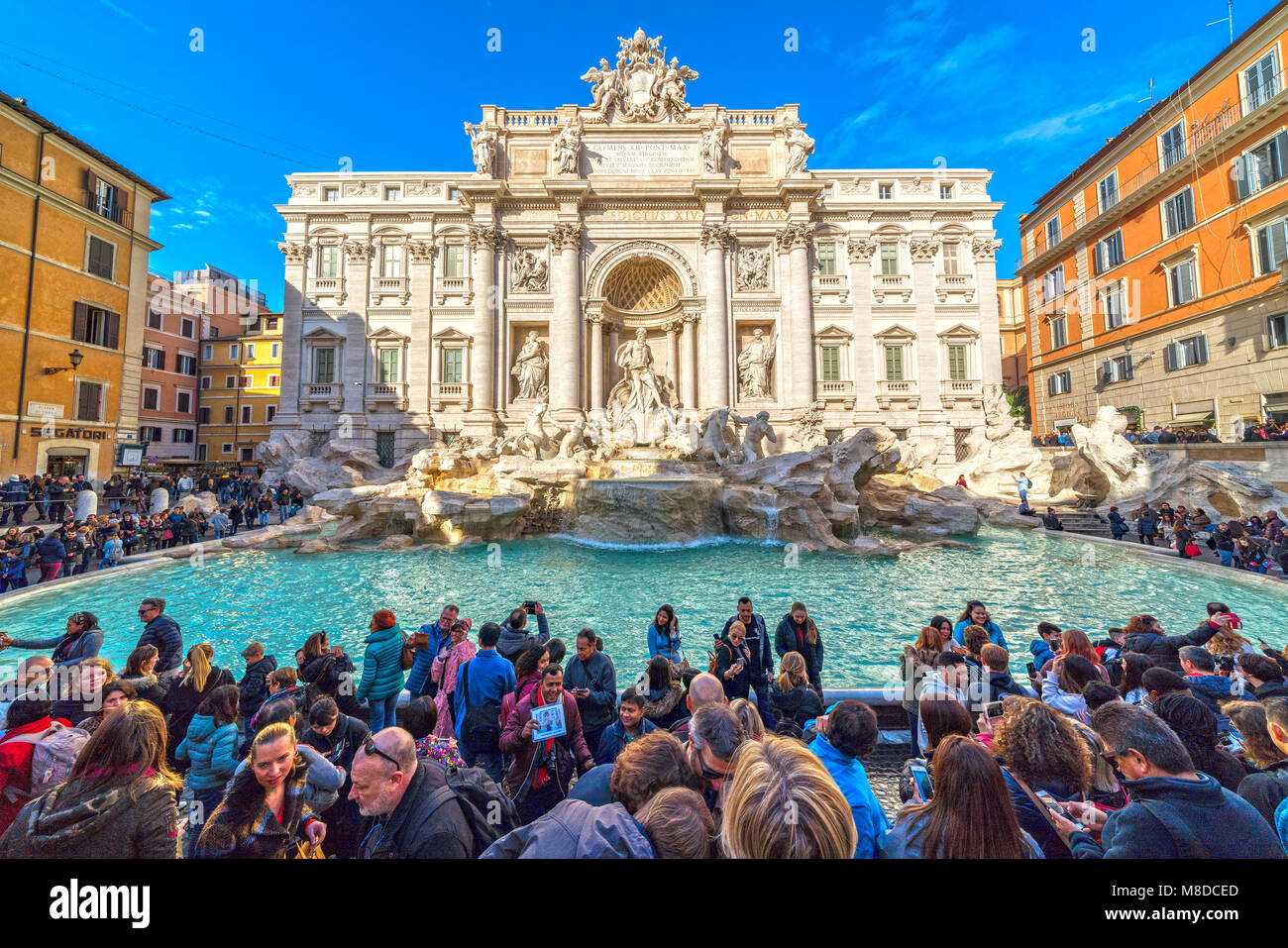ROME, ITALY - JANUARY 5, 2018: Tourists visiting the famous Trevi ...