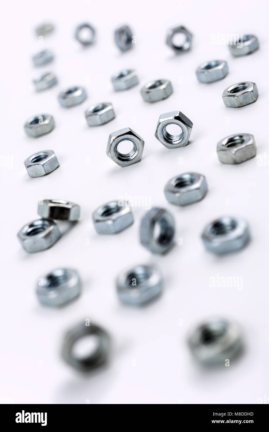 Collection of Bolt Nuts In A White Box - Crooked Angle Stock Photo - Alamy