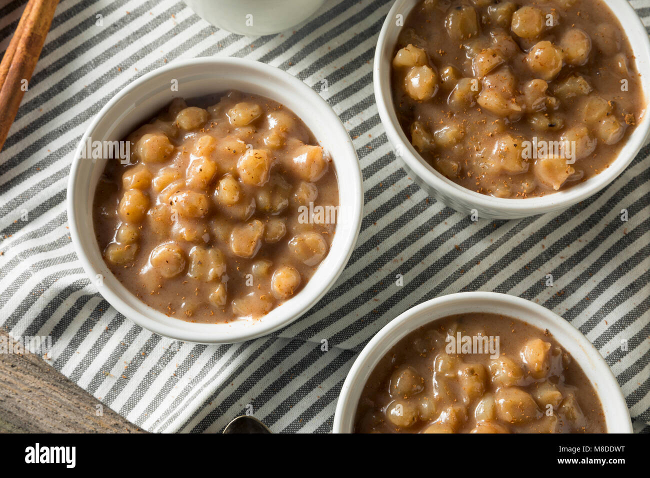 Homemade Brazlian Canjica Hominy Pudding with Cinnamon Stock Photo - Alamy