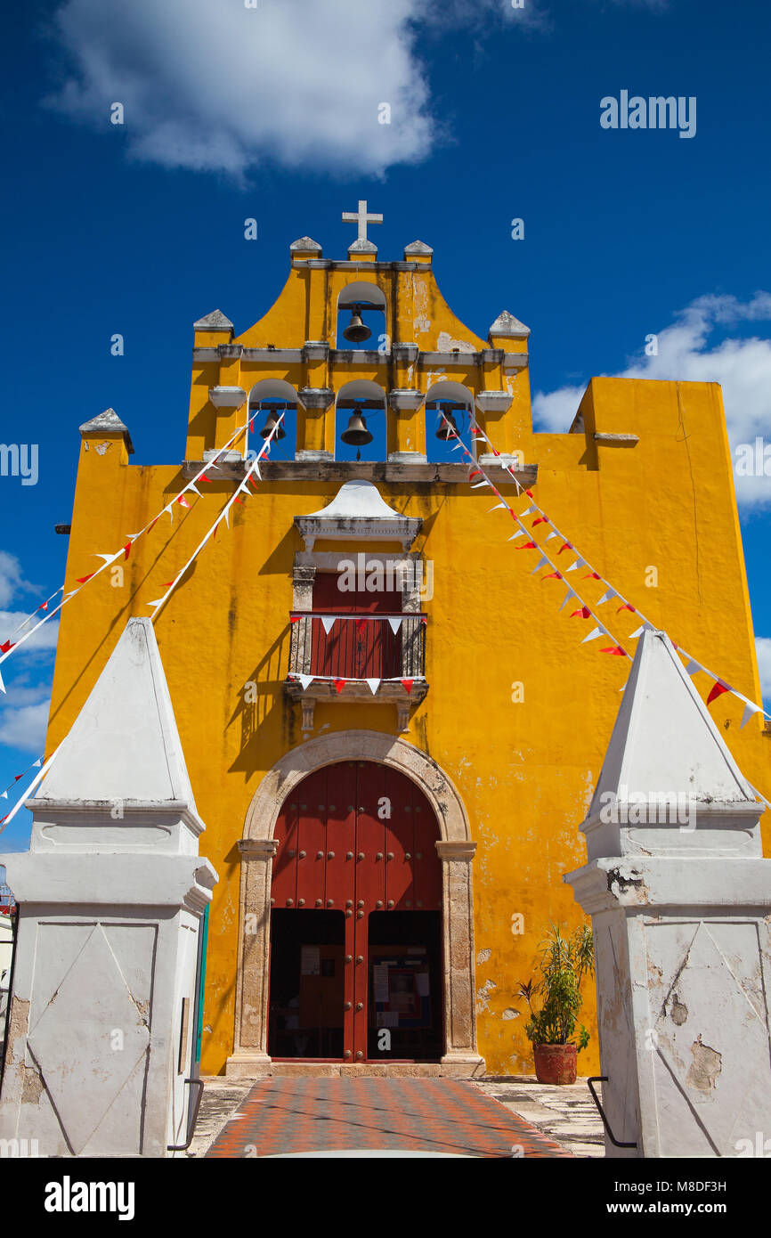 Yellow colonial church with a deep blue sky in Campeche, Mexico. The ...