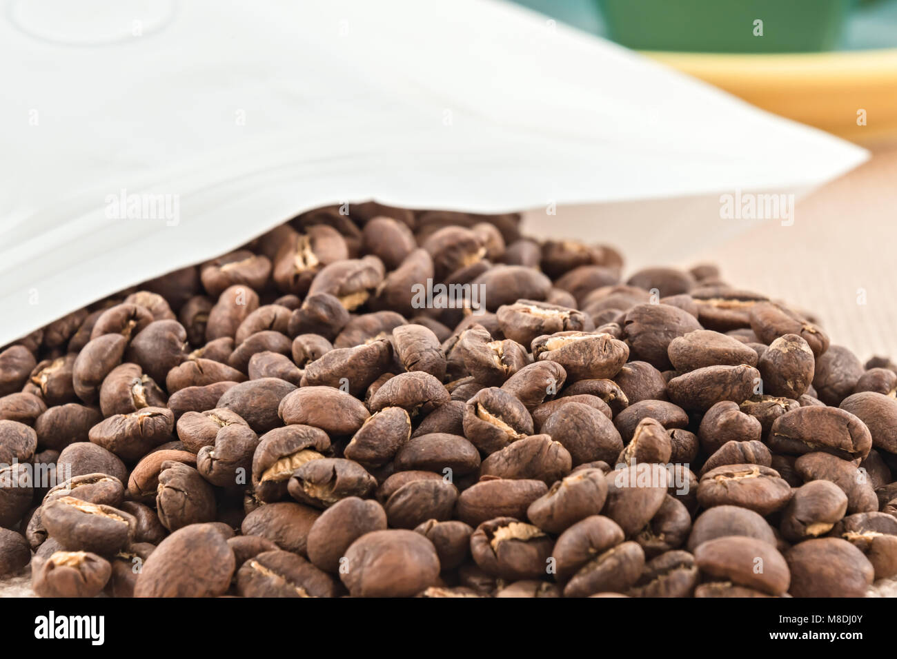 coffee envelope in open beans closeup Stock Photo - Alamy