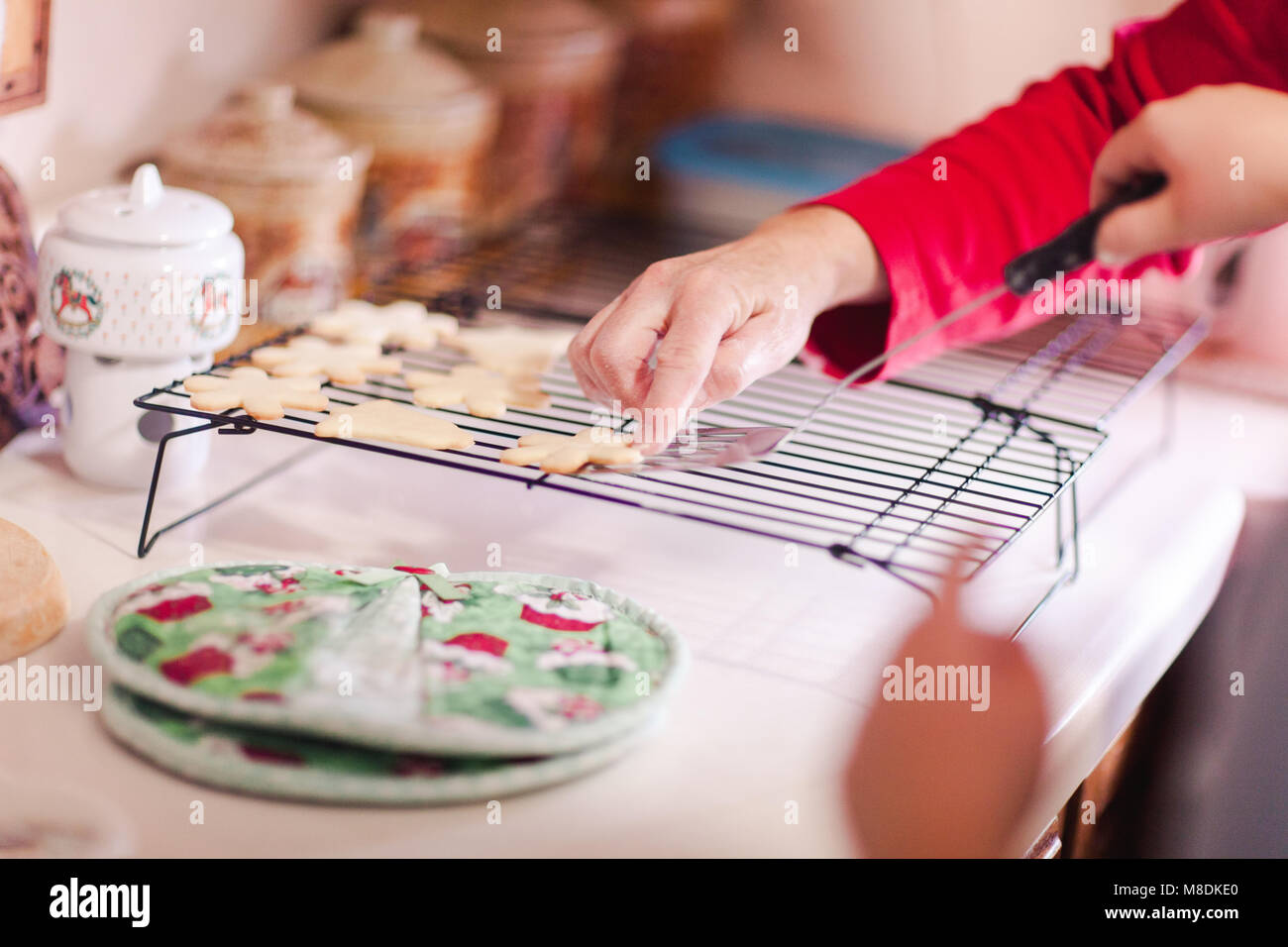 Hand placing cookie hi-res stock photography and images - Alamy