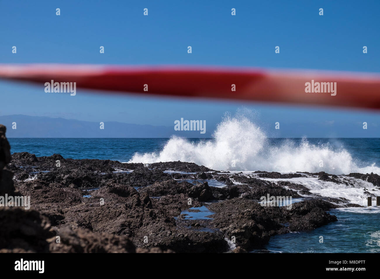 Red tape across the rocks to prevent people going to the shoreline ...