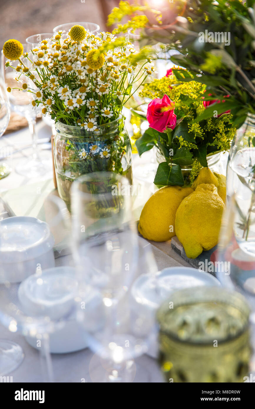 Flower arrangement on table setting Stock Photo - Alamy