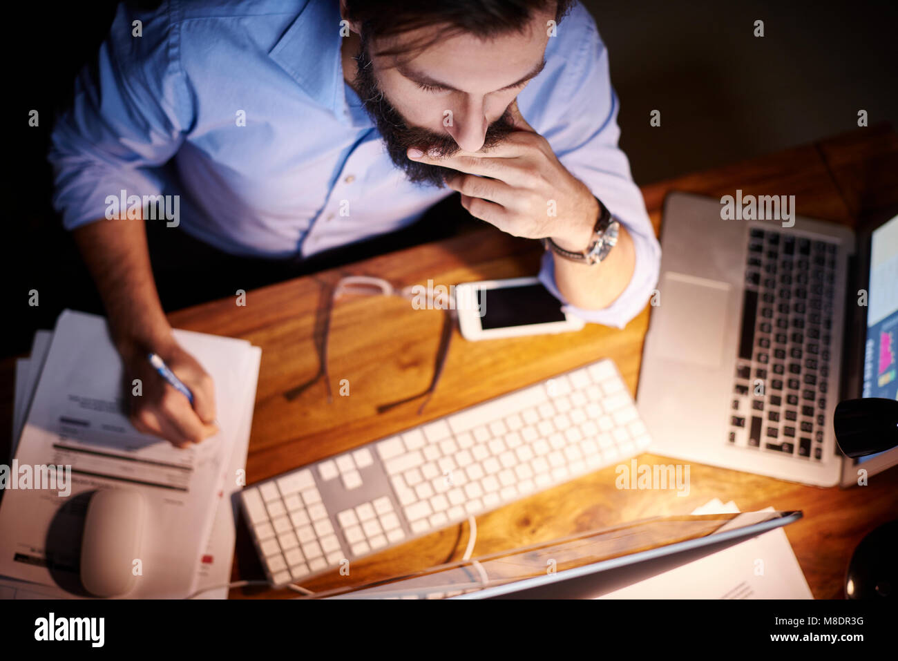 Overhead view of desk, man working hi-res stock photography and images ...