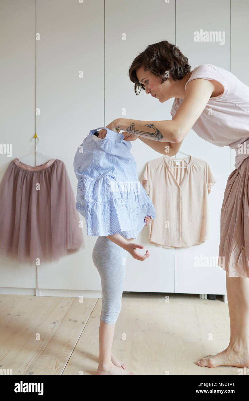 Getting dressed child dress hi-res stock photography and images - Alamy