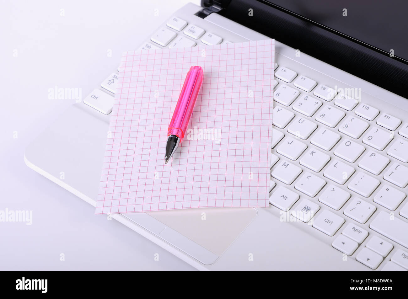 Sheet of paper, pen and laptop Stock Photo - Alamy