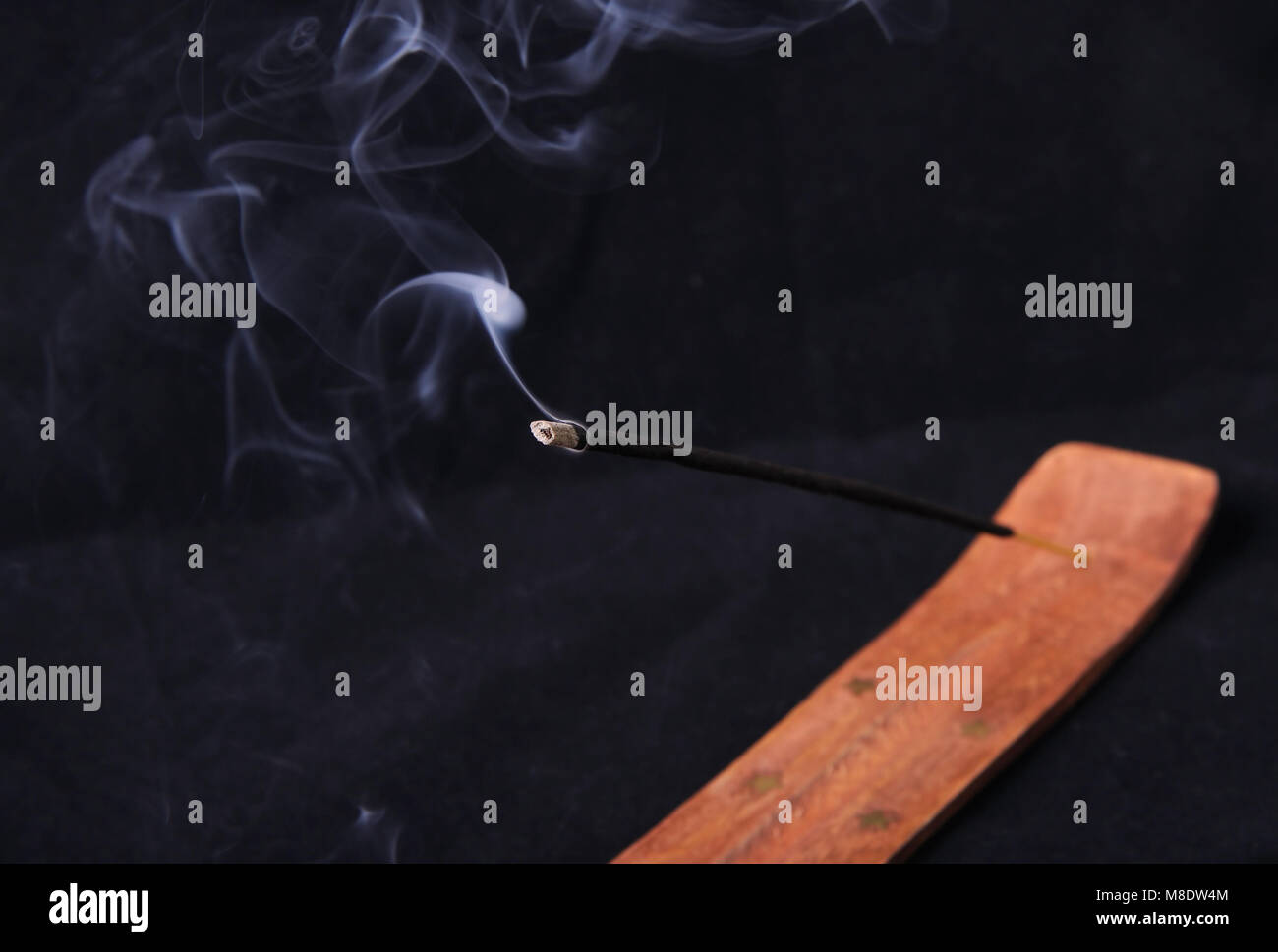 Smoldering incense stick on a stand Stock Photo - Alamy