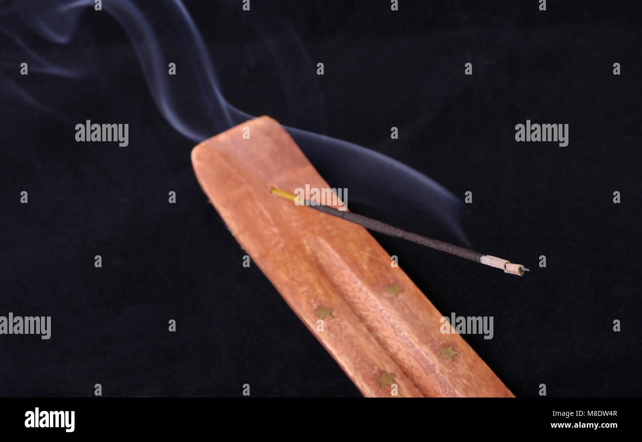 Smoldering incense stick on a stand Stock Photo - Alamy