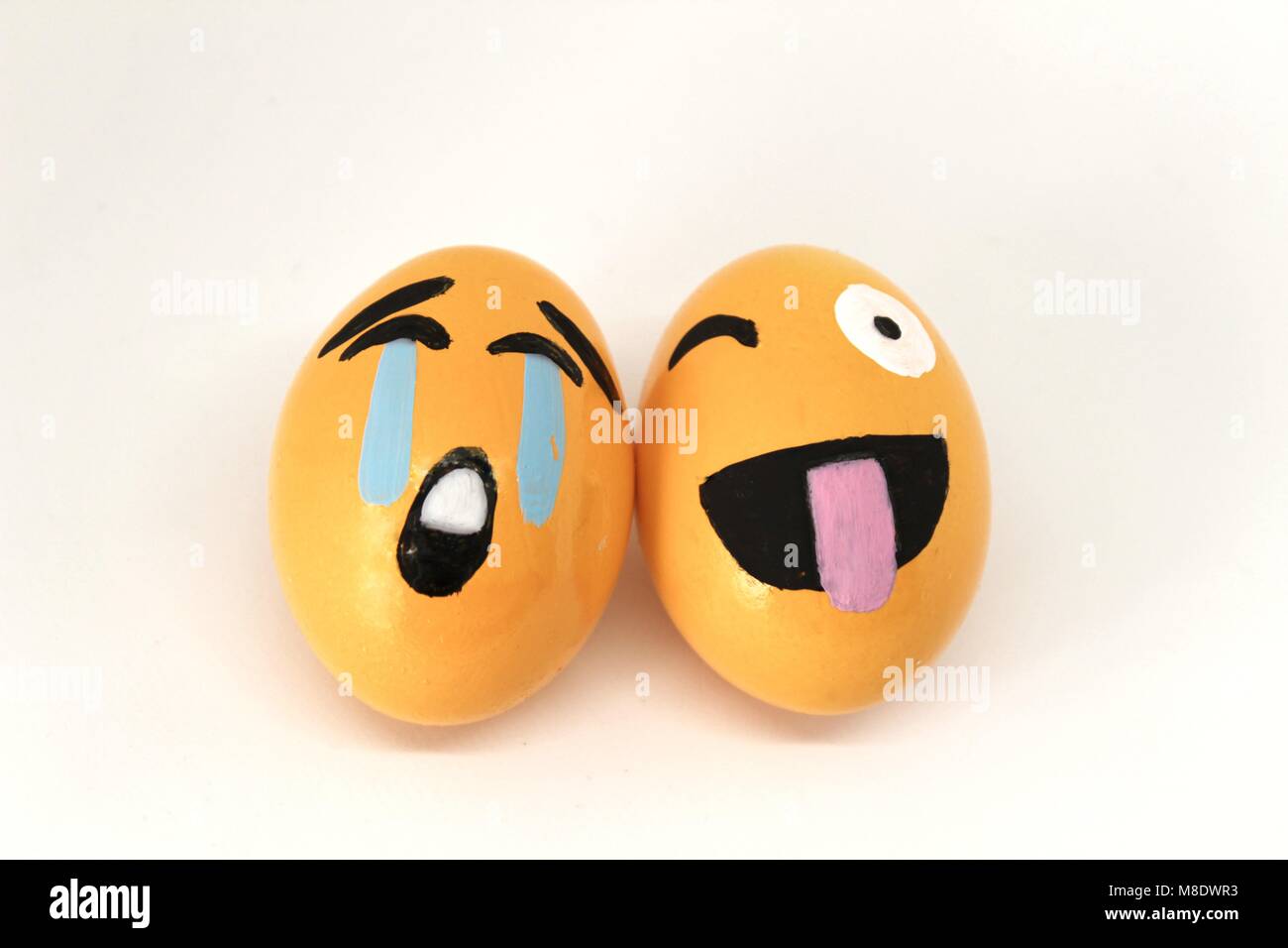 Smiling and crying Emoticons Easter Eggs and white background Stock ...