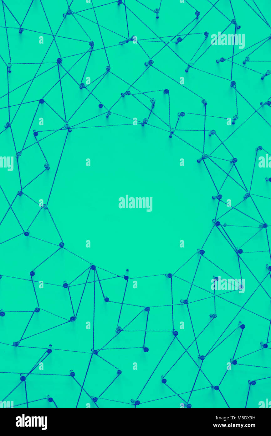 A large grid of pins connected with string. Communication, technology ...