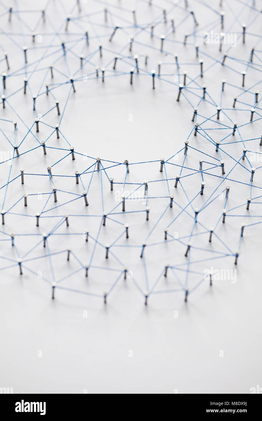 A large grid of pins connected with string. Communication, technology ...