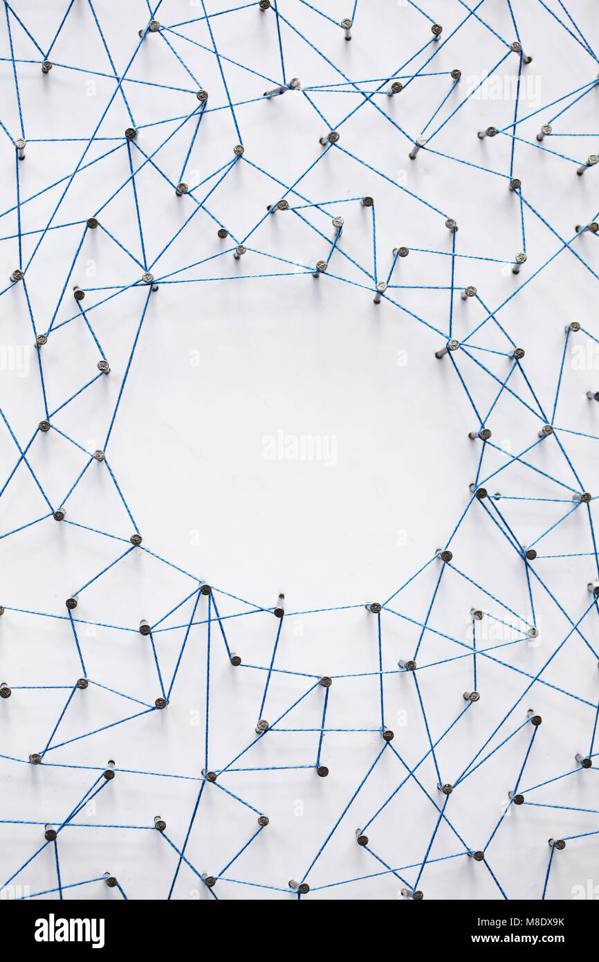 A large grid of pins connected with string. Communication, technology ...