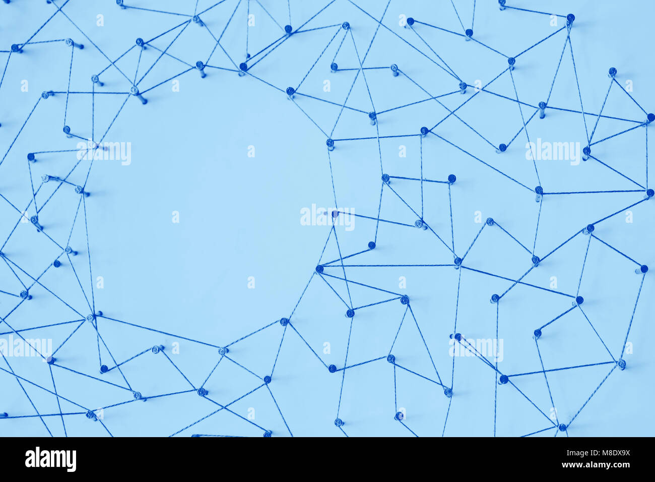A large grid of pins connected with string. Communication, technology ...
