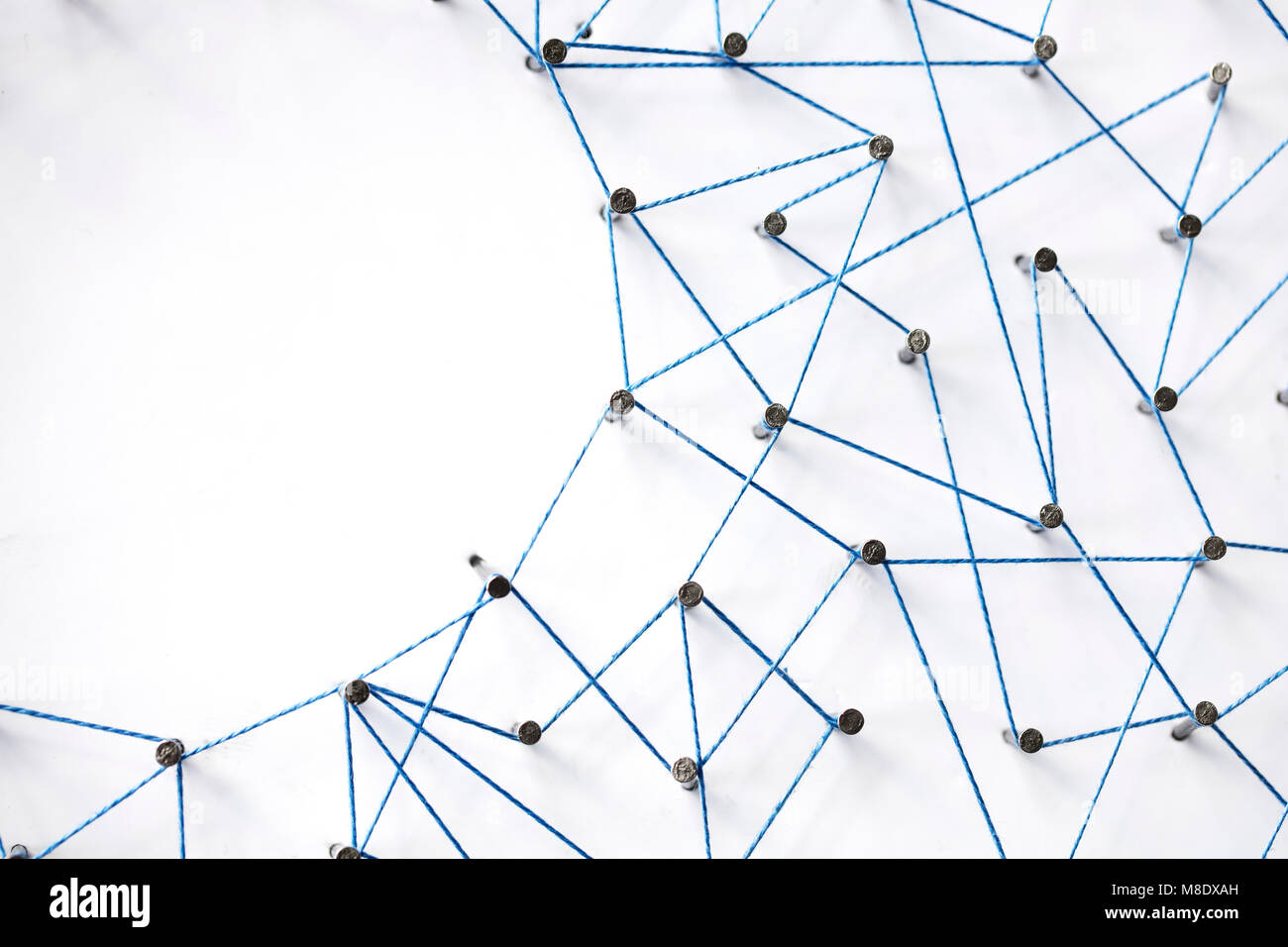 A large grid of pins connected with string. Communication, technology ...