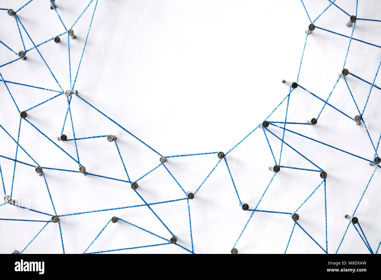 A large grid of pins connected with string. Communication, technology ...