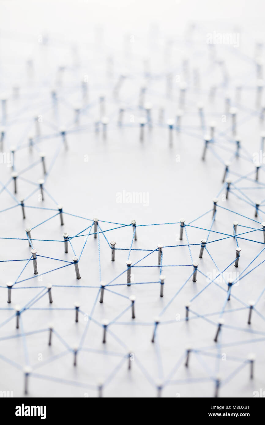 A large grid of pins connected with string. Communication, technology ...