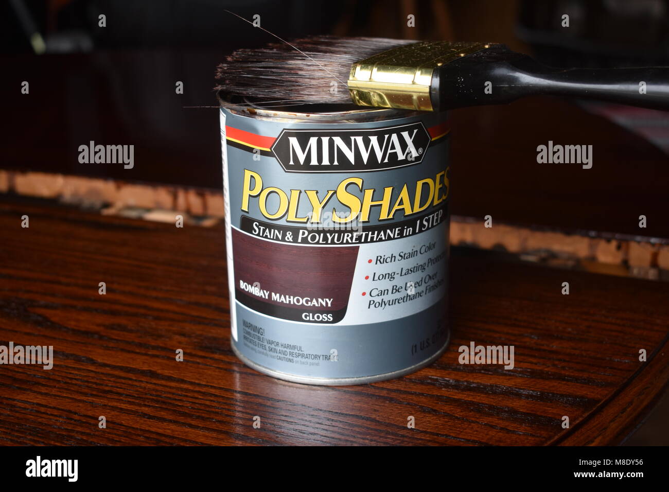 can of stain on table Stock Photo - Alamy