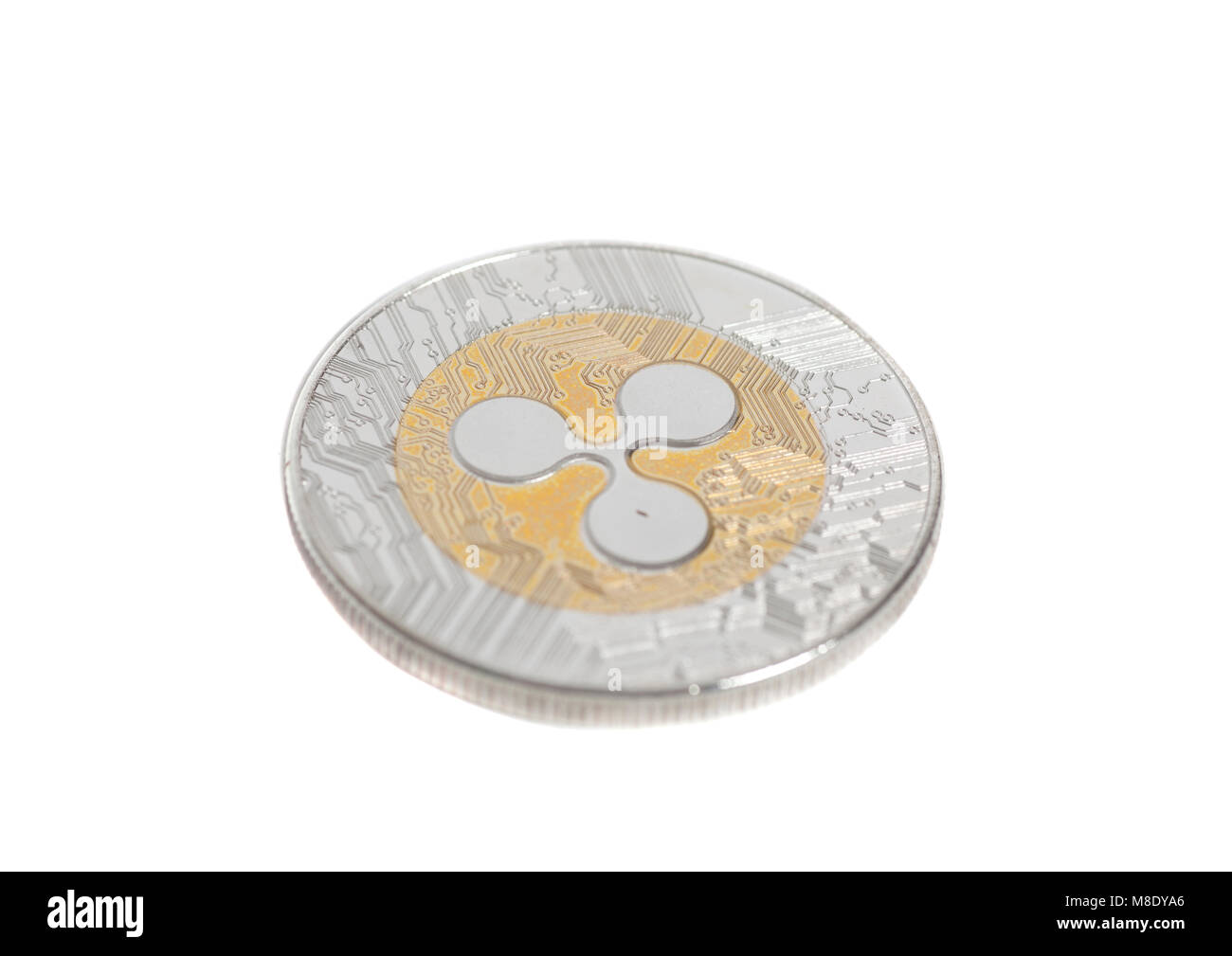 Golden ripple coin isolated on white background Stock Photo - Alamy