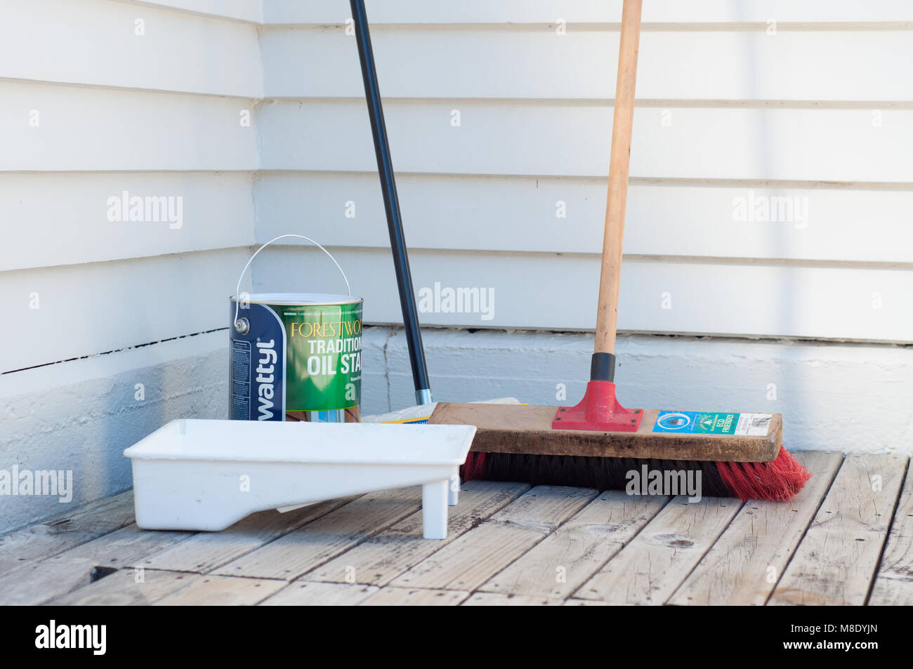 Broom Paint Tray And Deck Stain Stock Photo - Alamy