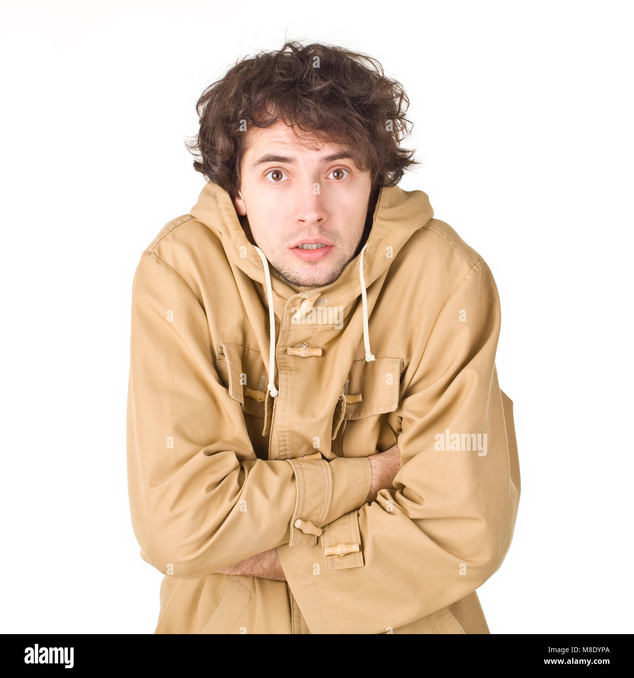 Man in brown raincoat feeling cold Stock Photo - Alamy