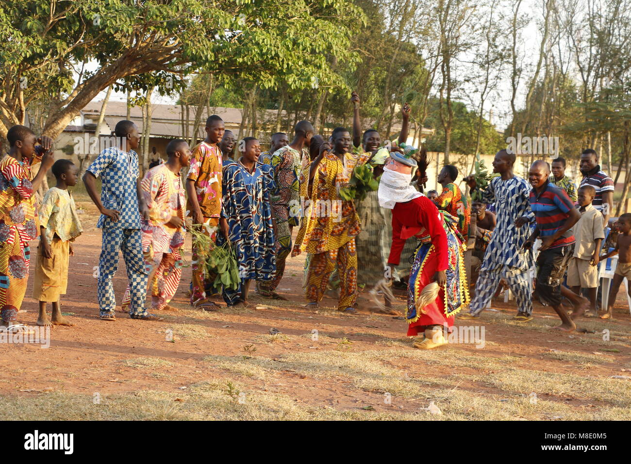 Gelede festival in Ketou Benin, Masked people have a competition with ...